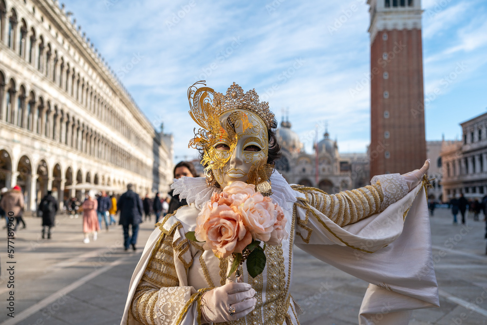Costumed carnival participants and revellers mingle with tourists ...