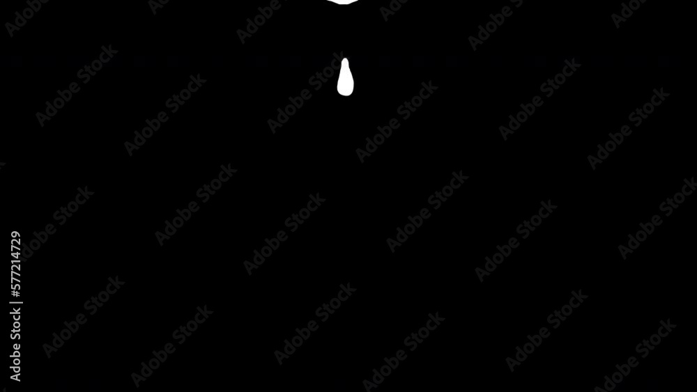 Animated video 4K. White drop of milk on black background falls and ...