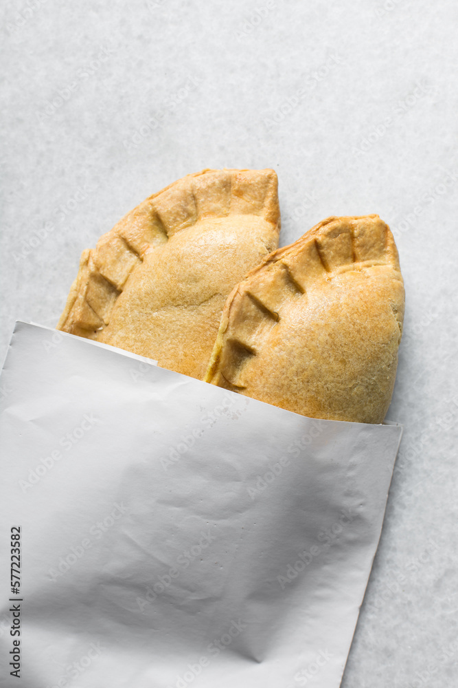 Stockfoto Nigerian meat pie in white bakery bag, freshly baked nigerian ...