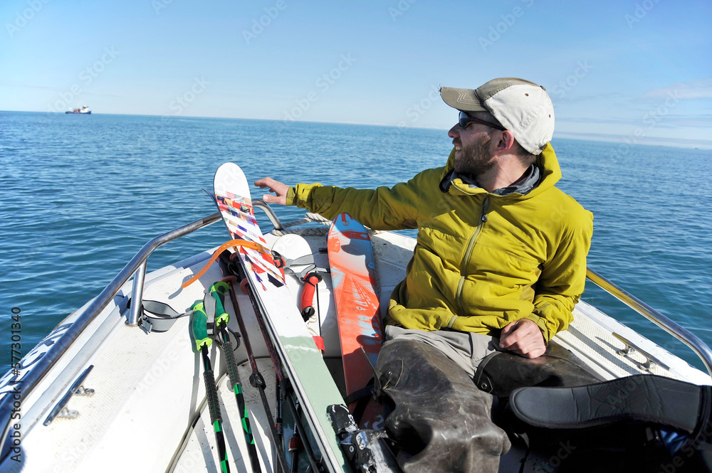 Skiers load a skiff for the return to the 58-foot Alaskan Seiner M/V ...