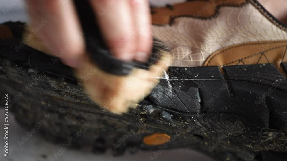 Close up side view of unrecognizable male wearing yellow rubber gloves ...