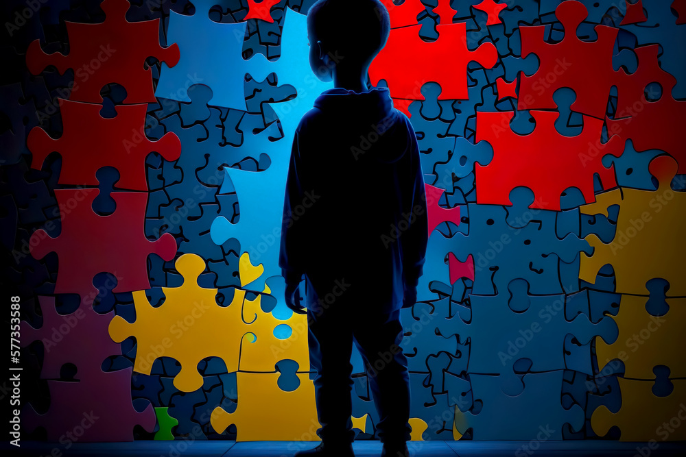 World autism awareness day. Little boy standing before the wall made ...