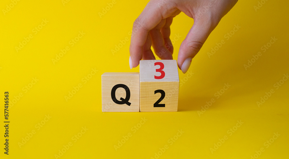 From 2nd Quarter to 3rd symbol. Businessman hand Turnes cube and ...