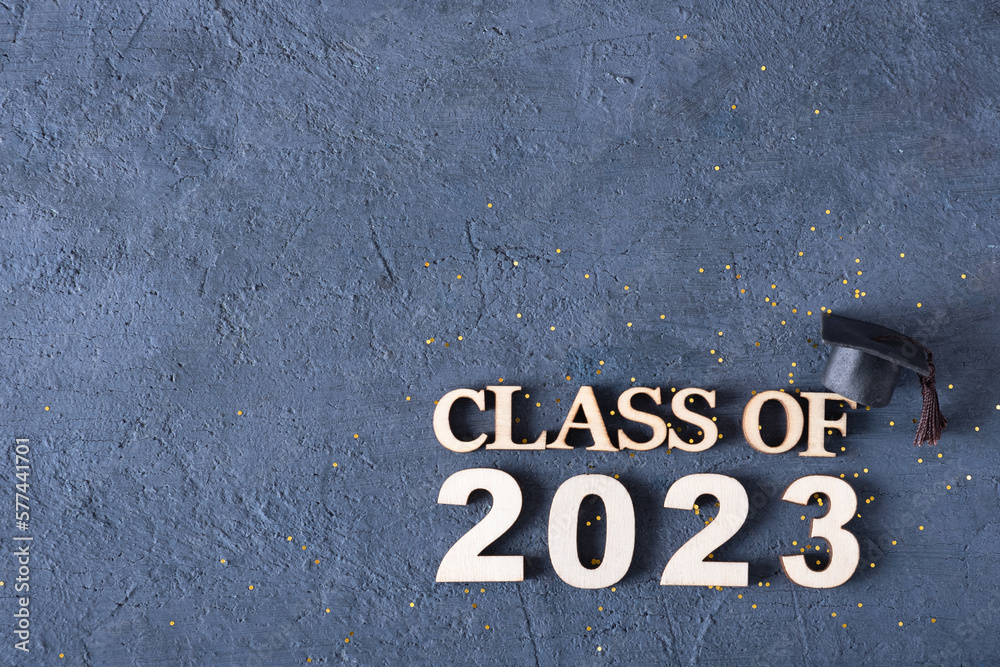 Class of 2023 concept. Wooden number 2023 with graduated cap on cement ...