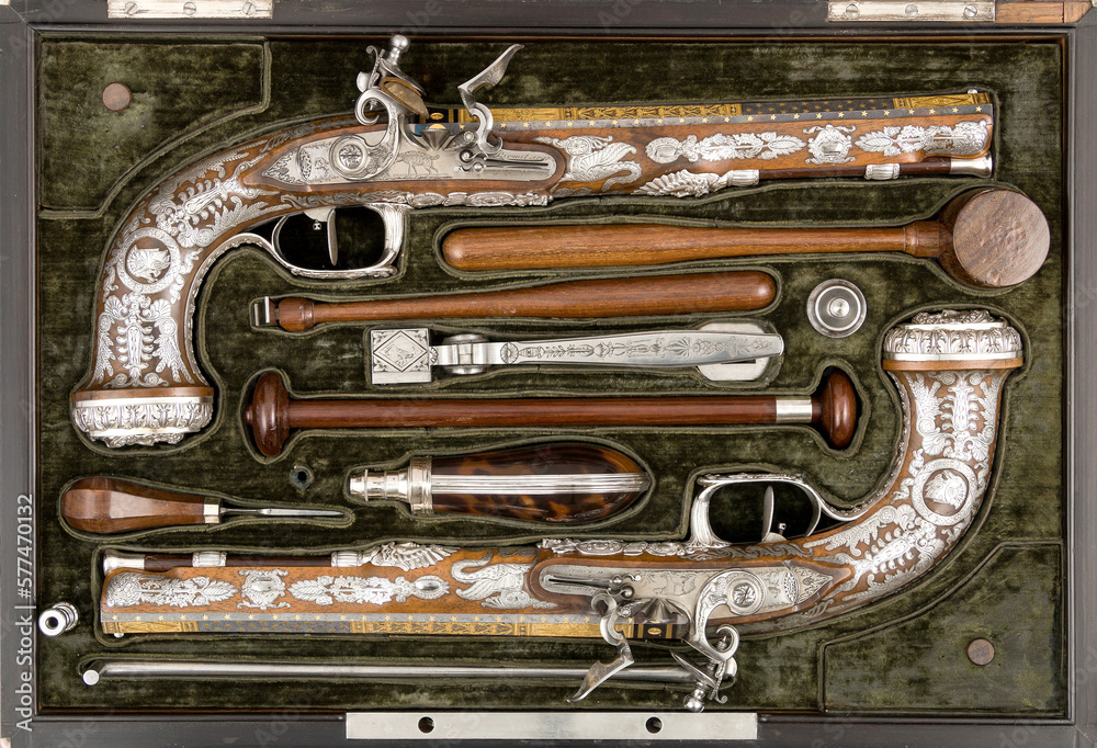 Cased pair of ancient flintlock pistols with accessories Stock Photo ...