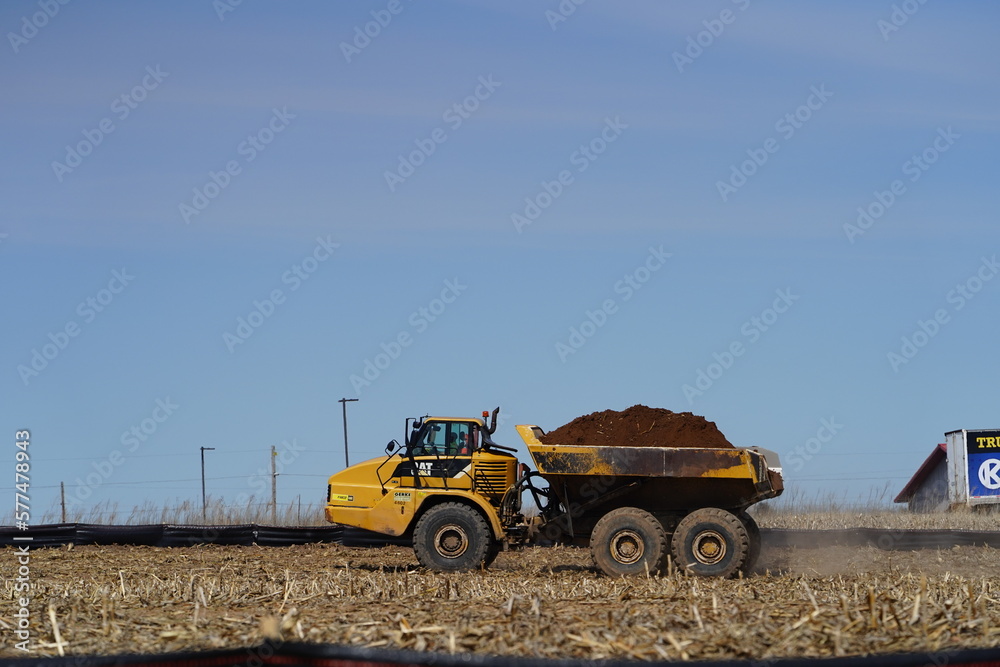 Articulated haul truck being used to move dirt and mud around. Stock ...