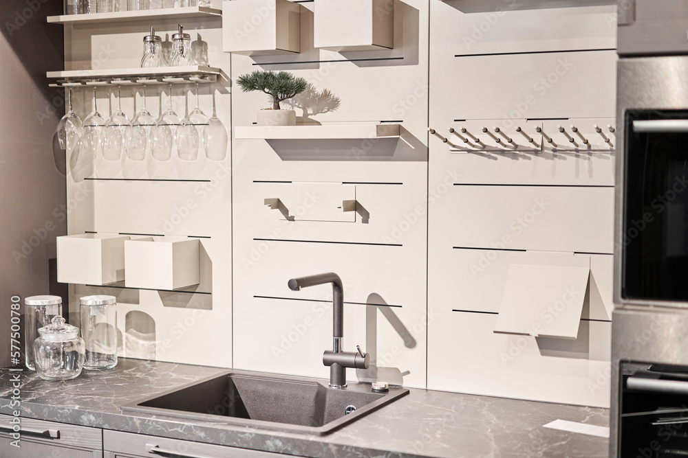 Stylish metallic crane at the kitchen. Sink faucet at the kitchen ...