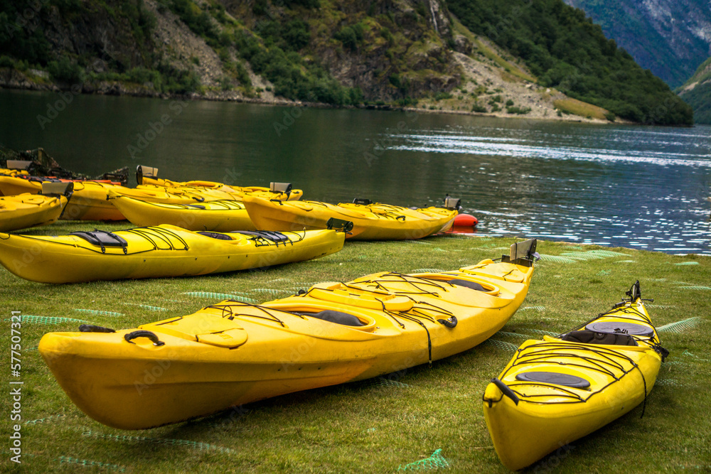 Yellow kayaks on the fjord in Norway, Gudvangen. Kayaks on fjord shore ...