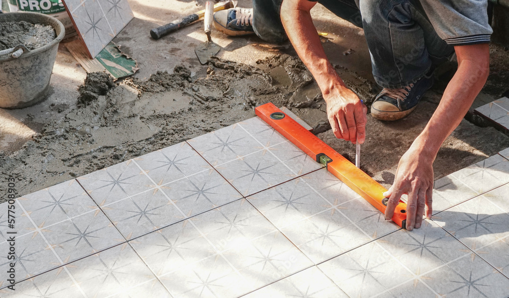 Floor tiles installation. Ceramic tiles and tools for tiler. Home ...