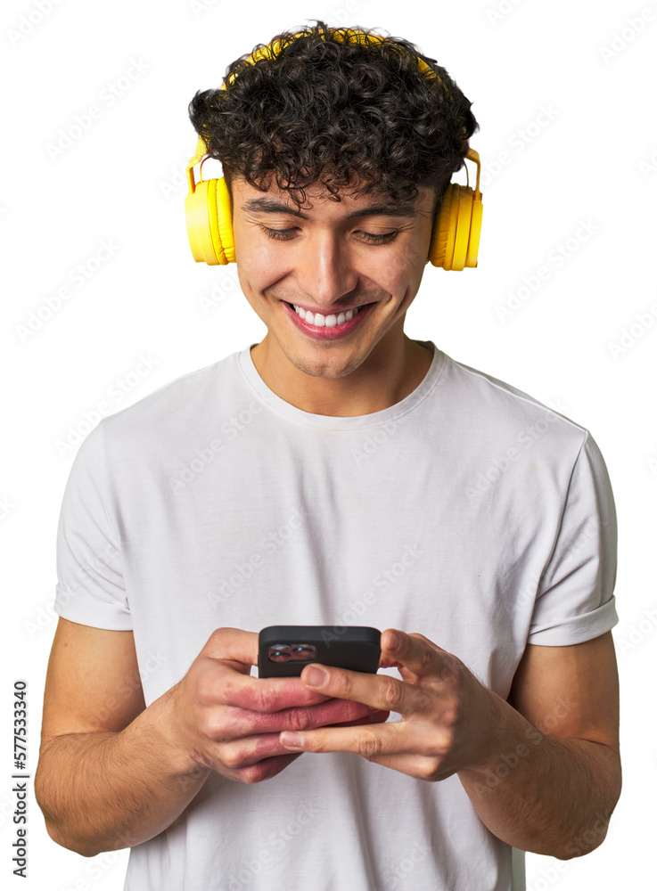 A young man gets lost in music and selects his favorite playlist on his ...