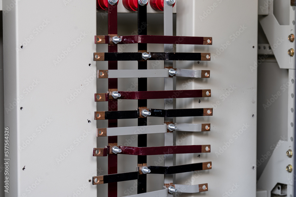 Assemble and install the busbar panel in the electrical system cabinet ...