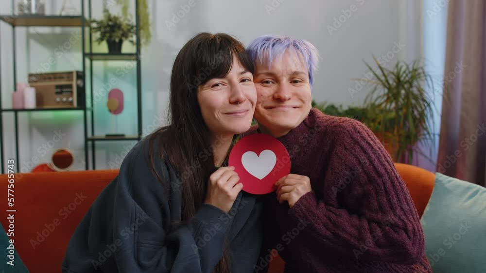 Two young lesbian women family couple or girls friends embracing ...