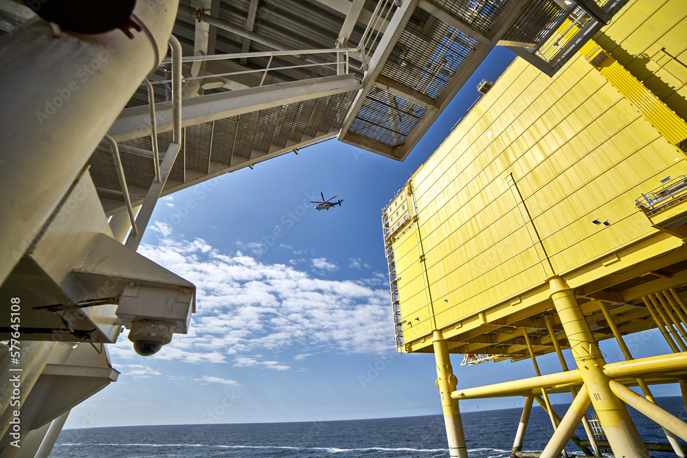 Divers support vessel working near offshore installation during ...