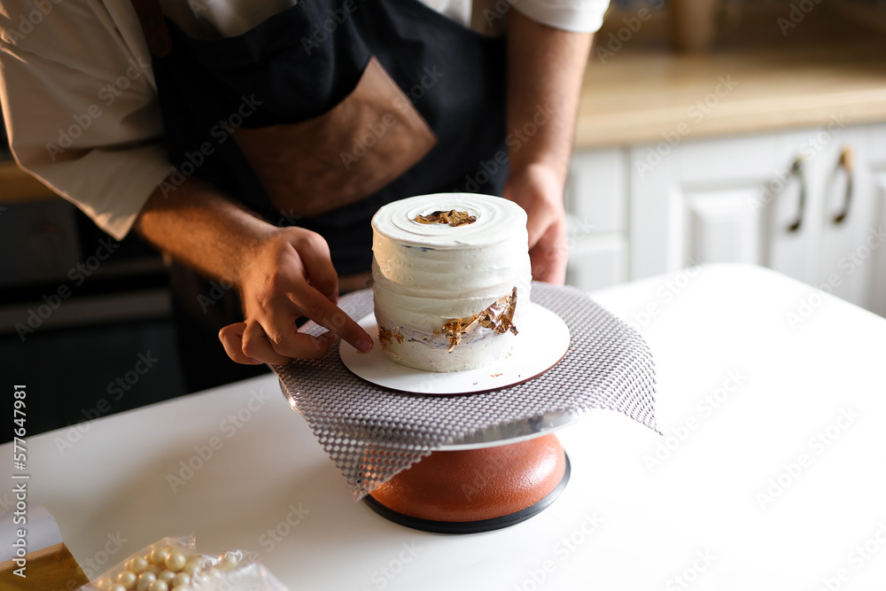 The pastry chef artist creates a masterpiece out of the cake with ...