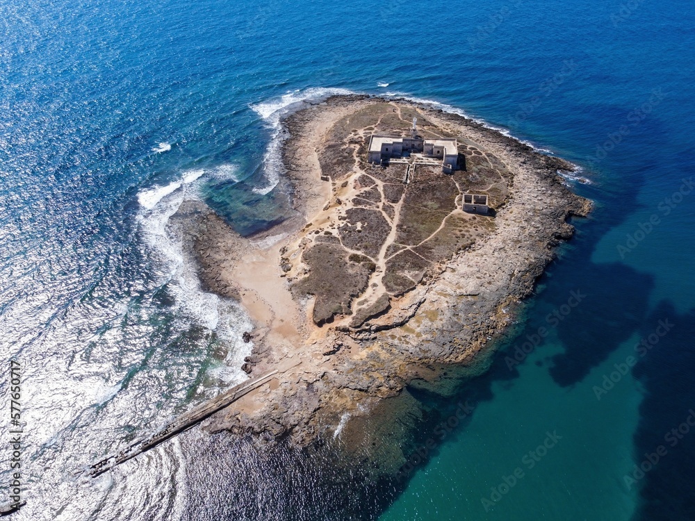 Aerial drone view of the island and beach of Isola delle Correnti with ...