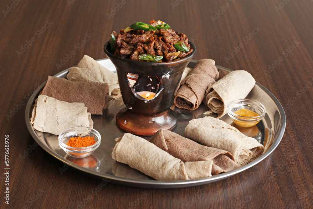 Eritrean dish called Shekla, beef served with flatbread and spices ...