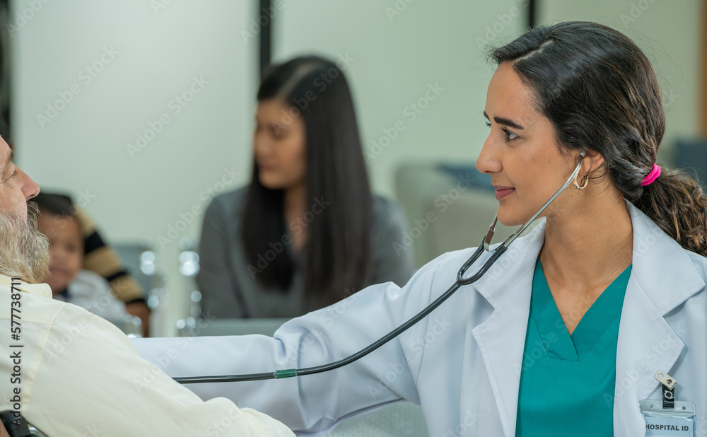 Woman doctors use stethoscope listening pulse examining patient check before surgery. Doctor ...