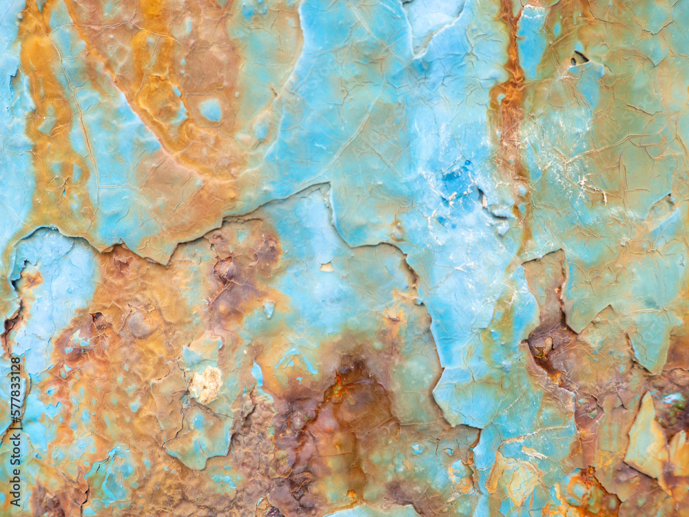 Rust on a blue surface. Cracks in the paint. Old iron. Rusty stains on ...
