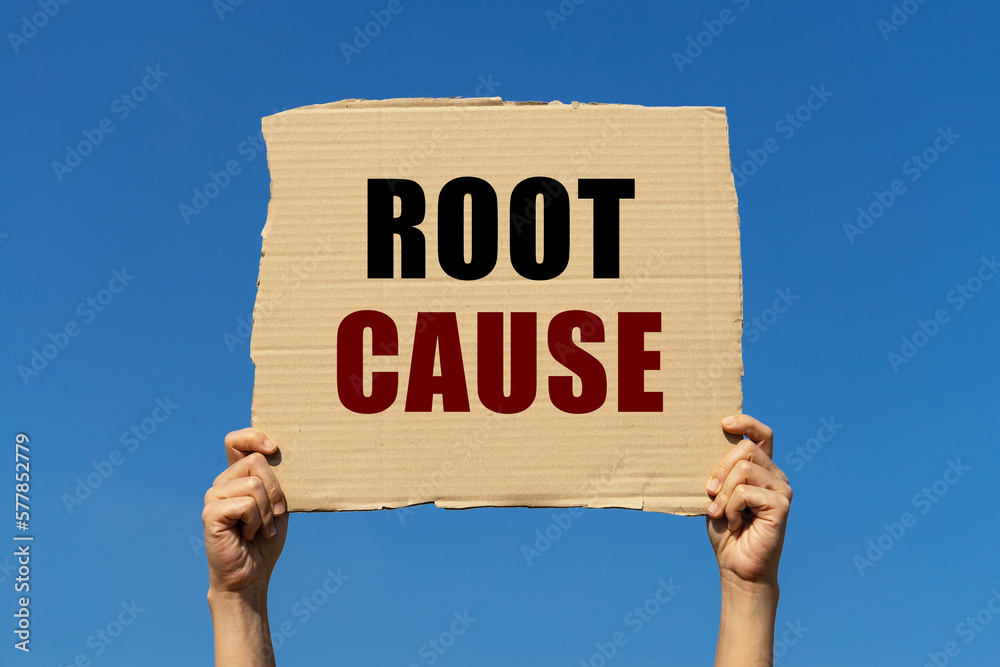 Root cause text on box paper held by 2 hands with isolated blue sky ...