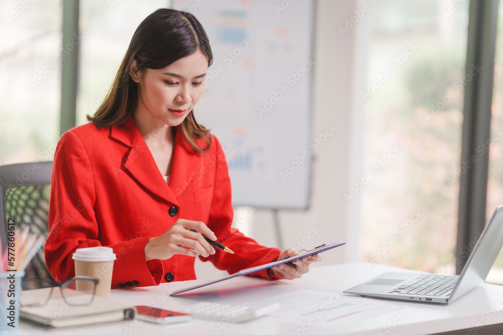 Female attractive asian banker accountant wearing red formal suit ...