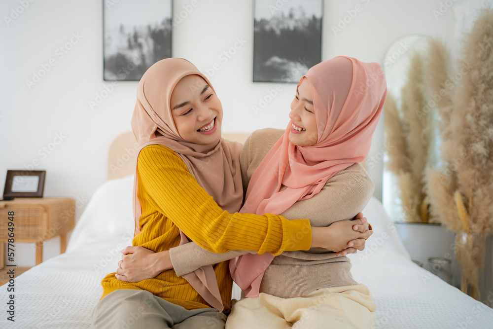 Young Beauty Muslim woman talking and laughing on the bed. Happy two ...