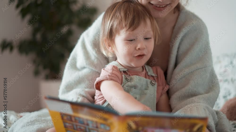 Caring single parent young mother babysitter hug happy cute little ...