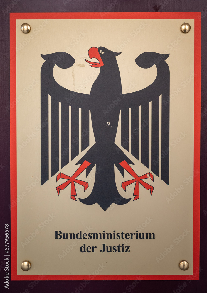 Coat of arms of Germany and lettering on a building of the German ...