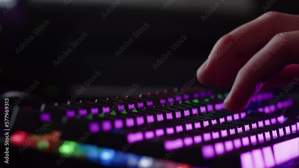 Male hands is typing on the computer keyboard, close up view. Fast ...