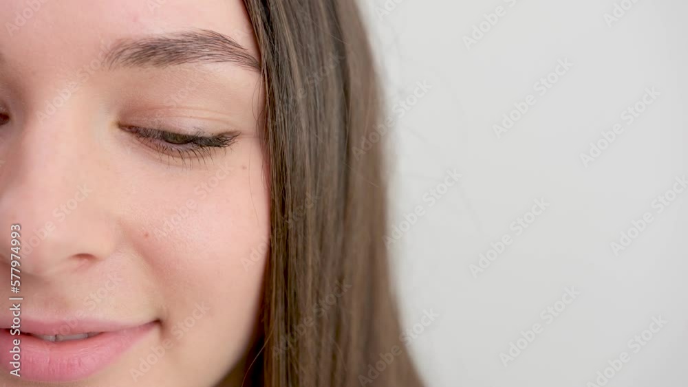 Be H3althy close-up half of face of young woman tender smile ...