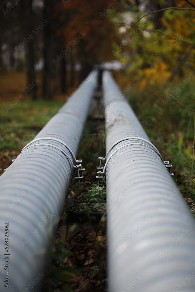Metal pipes on the street. pipes from the pipeline. gas pipeline for ...