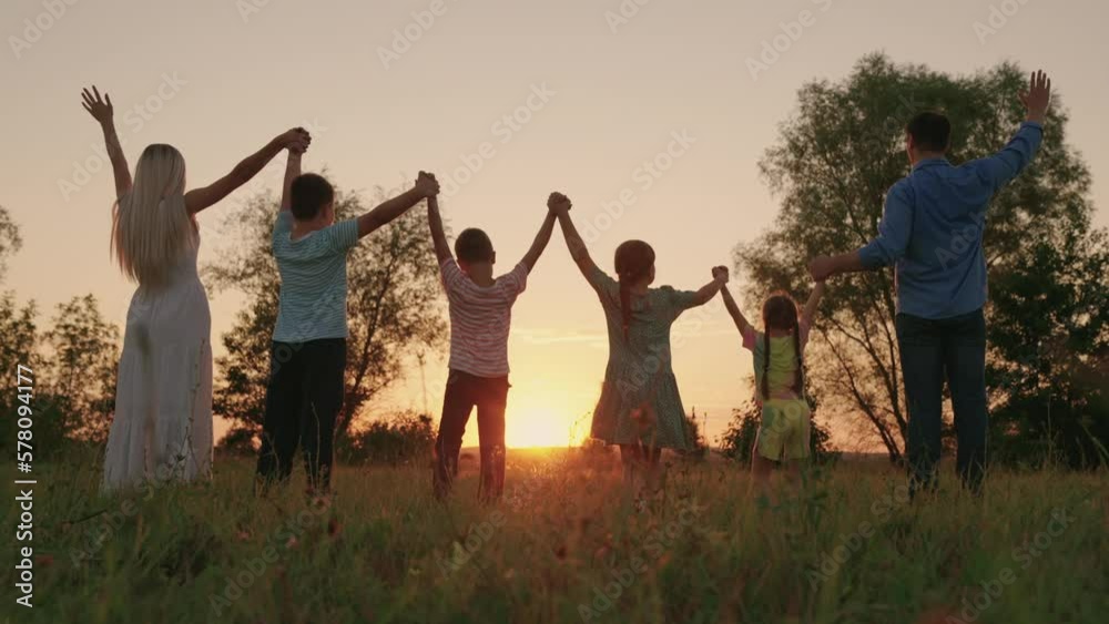 Parents, happy children, sun. Prayer of people. Big family, holding ...