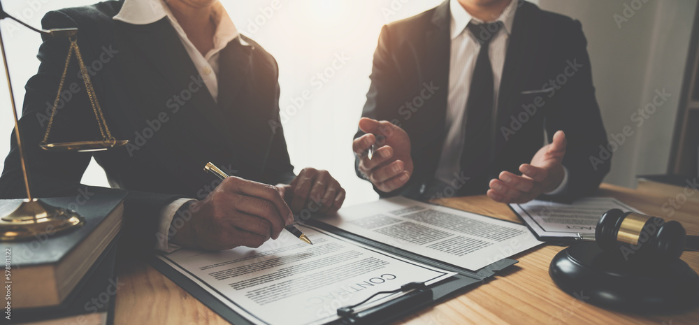 Lawyer, legal advisor, businessman brainstorming clarifying agreement ...