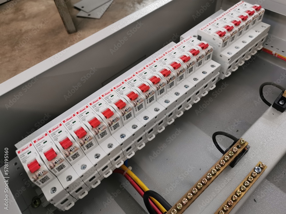 Selective focus image with noise effect a row of mcb mount on electrical cabinet in factory ...