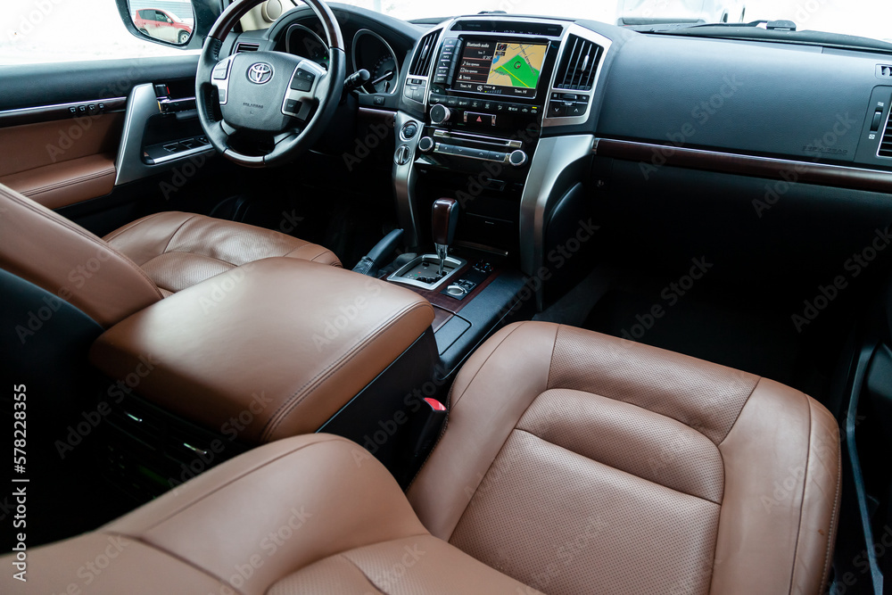 View to the interior of Toyota Land Cruiser 200 with dashboard, clock ...