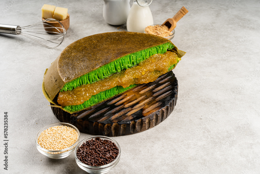 Martabak manis or terang bulan is indonesian sweet pancake, with green ...