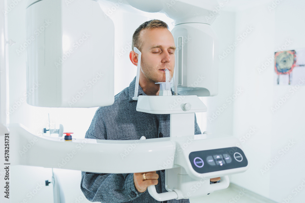 A young man underwent a CT scan of the jaw, a circular image of the jaw ...