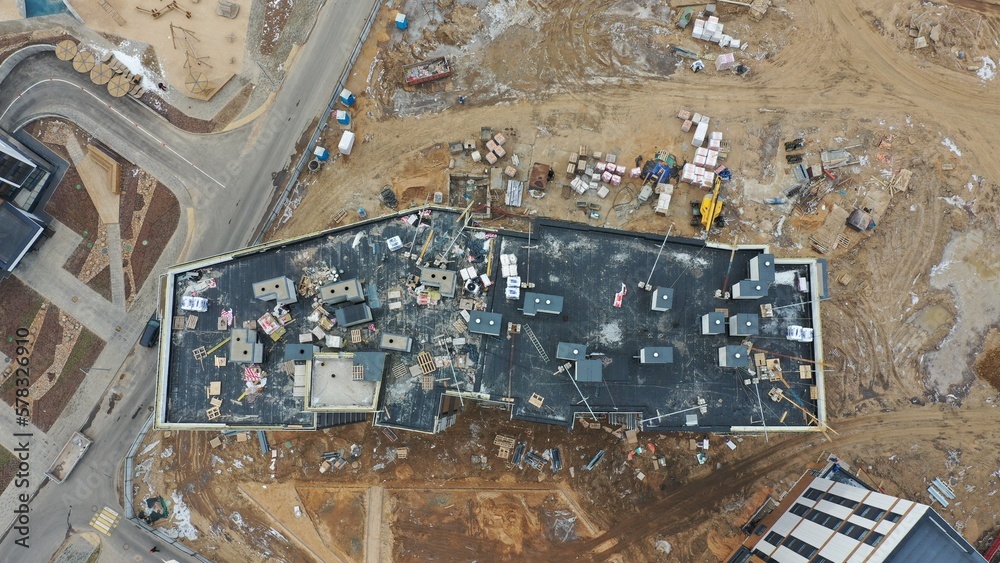 Vertical view down from above on the roof of a multi-storey residential ...