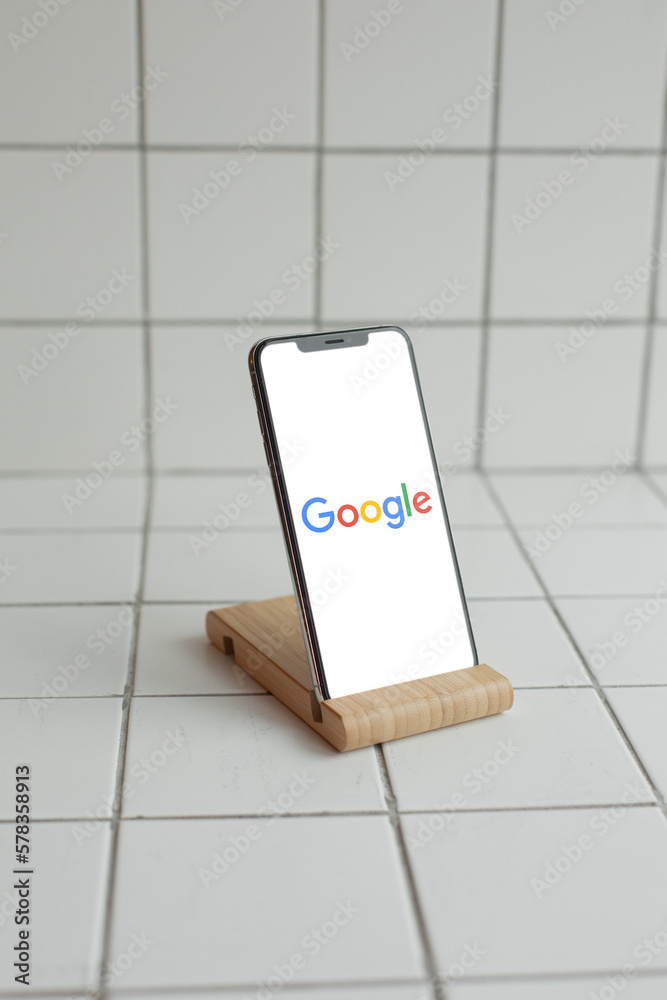 Mobile phone with the Google Logo on the screen Stock Photo | Adobe Stock