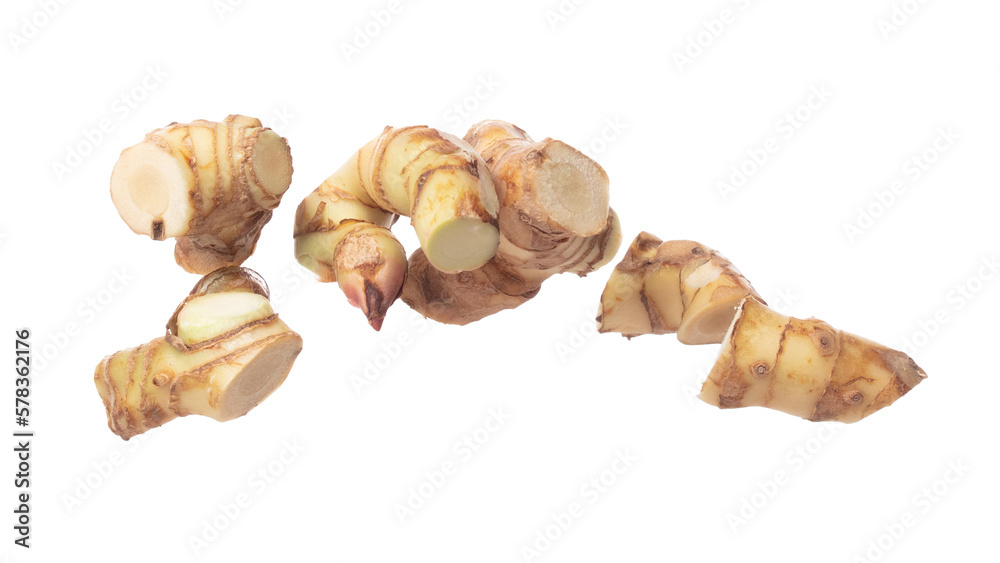 Galangal fly in mid air, fresh vegetable spice galangal falling ...
