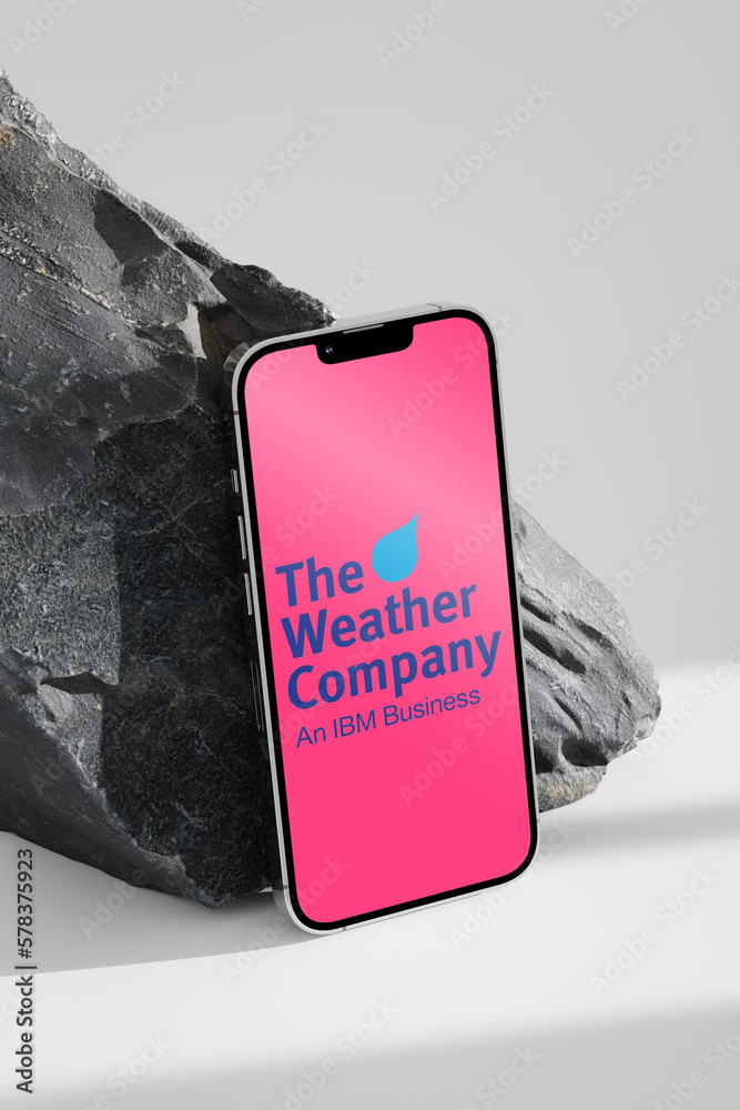 Mobile phone with the The Weather Company by IBM Logo on the screen ...
