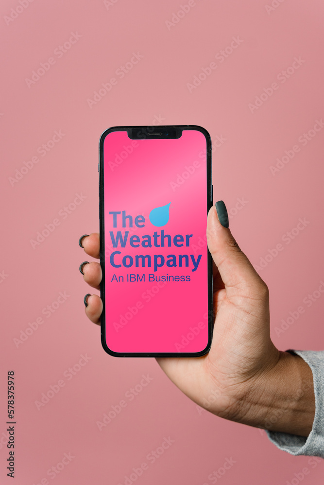 Mobile phone with the The Weather Company by IBM Logo on the screen ...