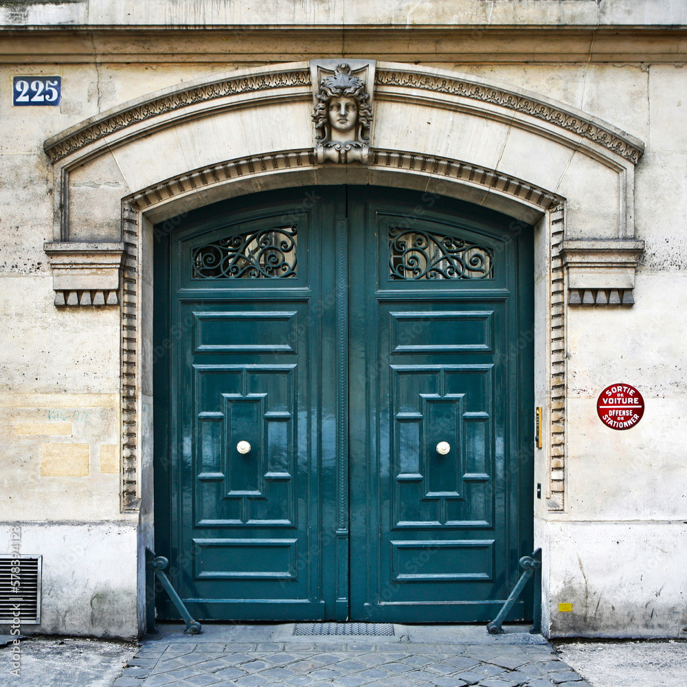 Paris ancient stone building entrance with wooden carved double doors ...