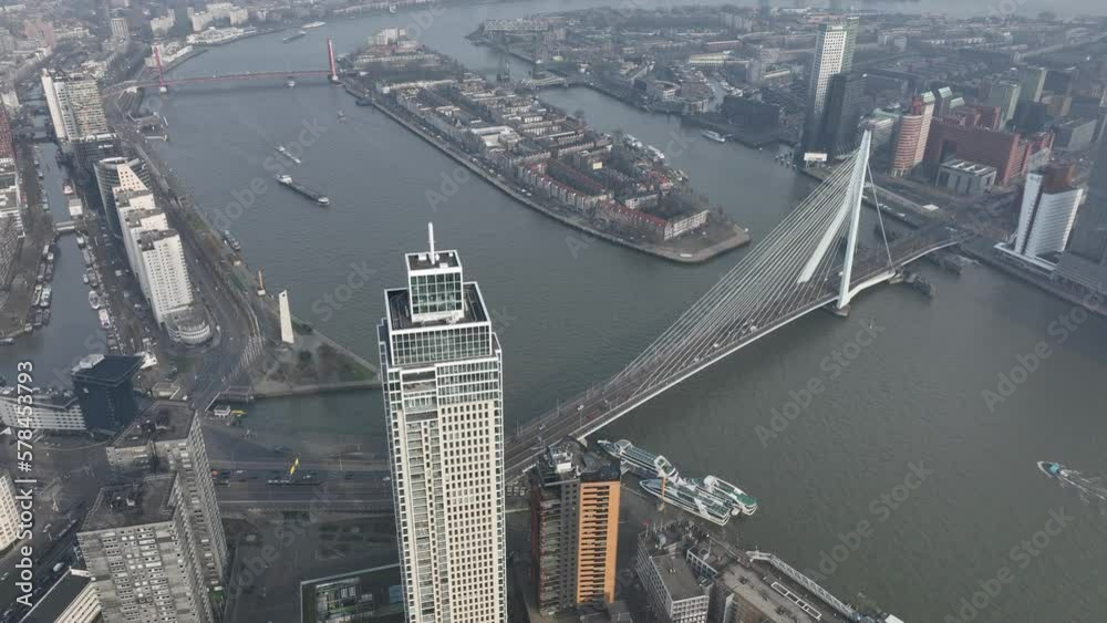 A sweeping aerial view of the iconic Erasmus Bridge in Rotterdam ...
