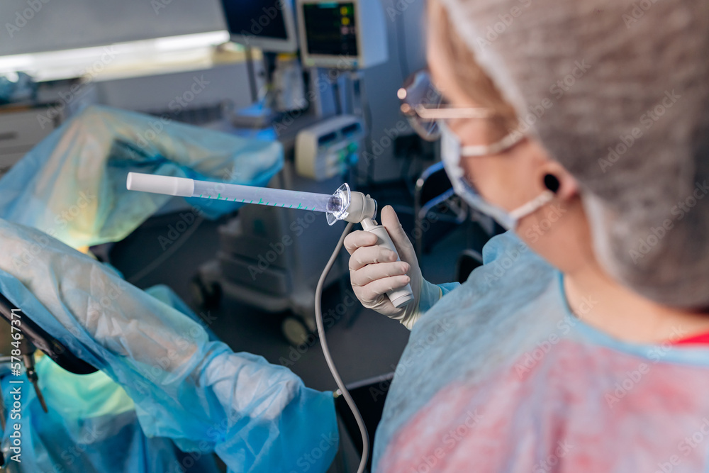 Professional surgeon proctologist before operation holding special ...