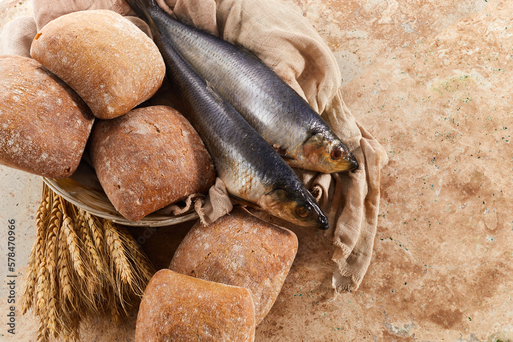 Catholic still life of five loaves of bread and two fish Stock Photo ...