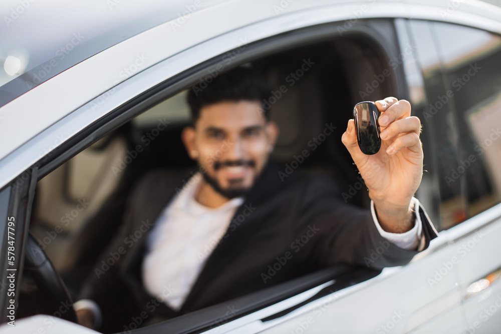 Handsome indian businessman sitting inside luxurious modern auto and ...