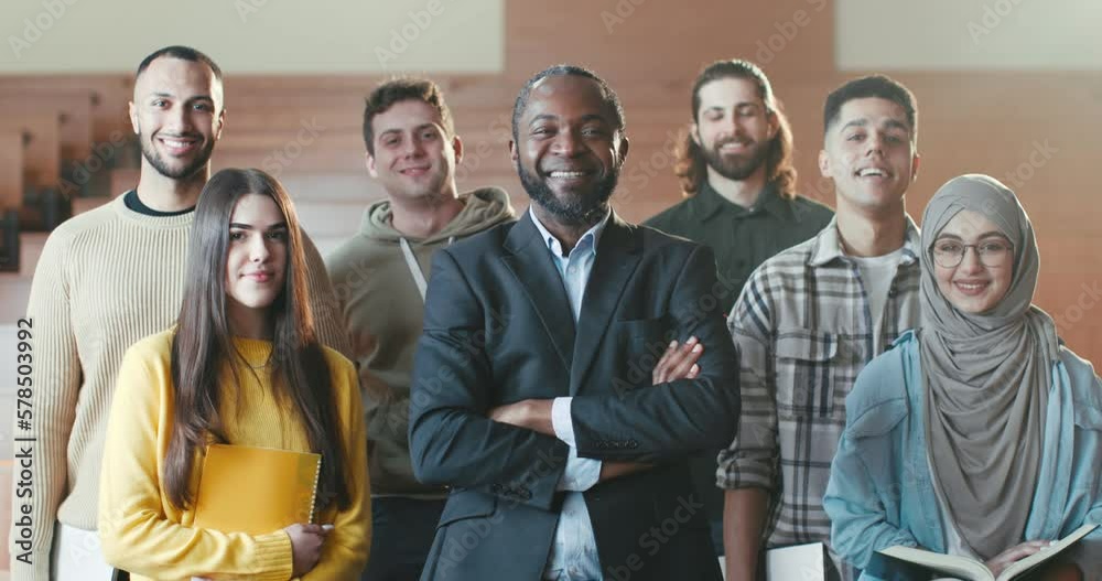 Portrait shot of African American male happy professor among mixed ...