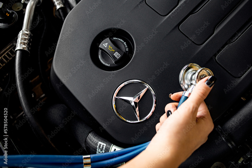 hand holding a car engine Mercedes Stock Photo | Adobe Stock