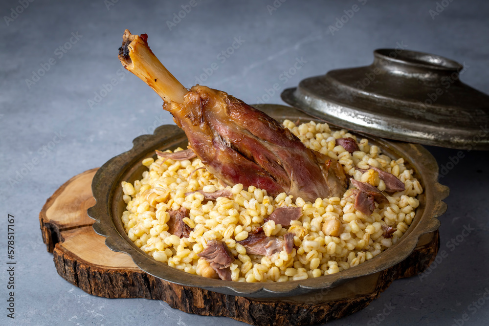 Turkish foods; lamb shank tandoori on bulgur wheat rice (Turkish name ...