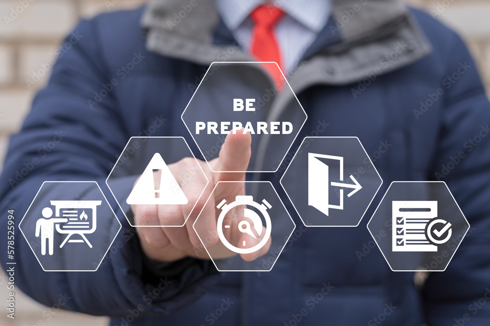 Businessman using virtual touchscreen presses inscription: BE PREPARED ...